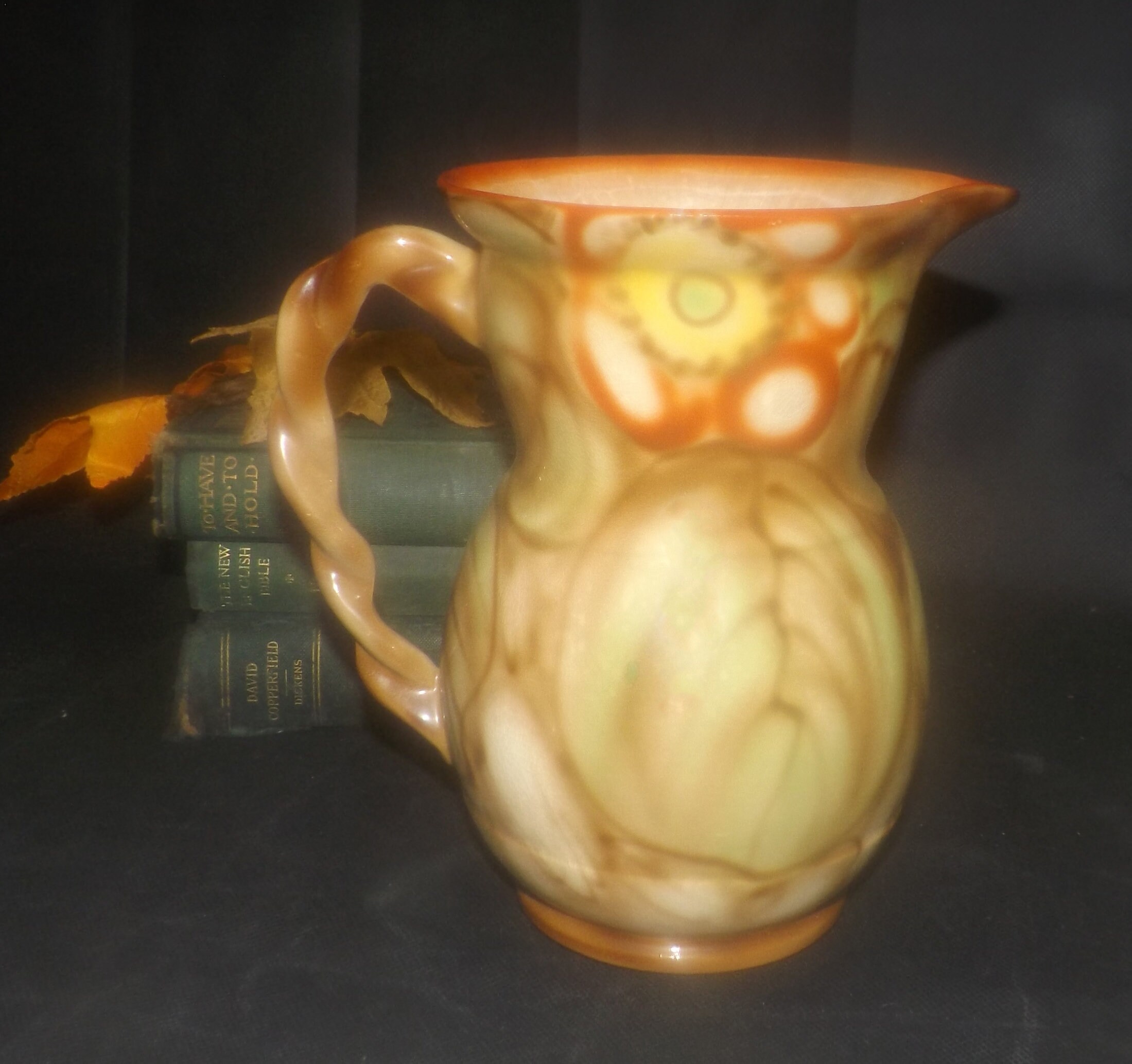 Royal Art Pottery 32 ounce pitcher. Red yellow florals, branch handle ...