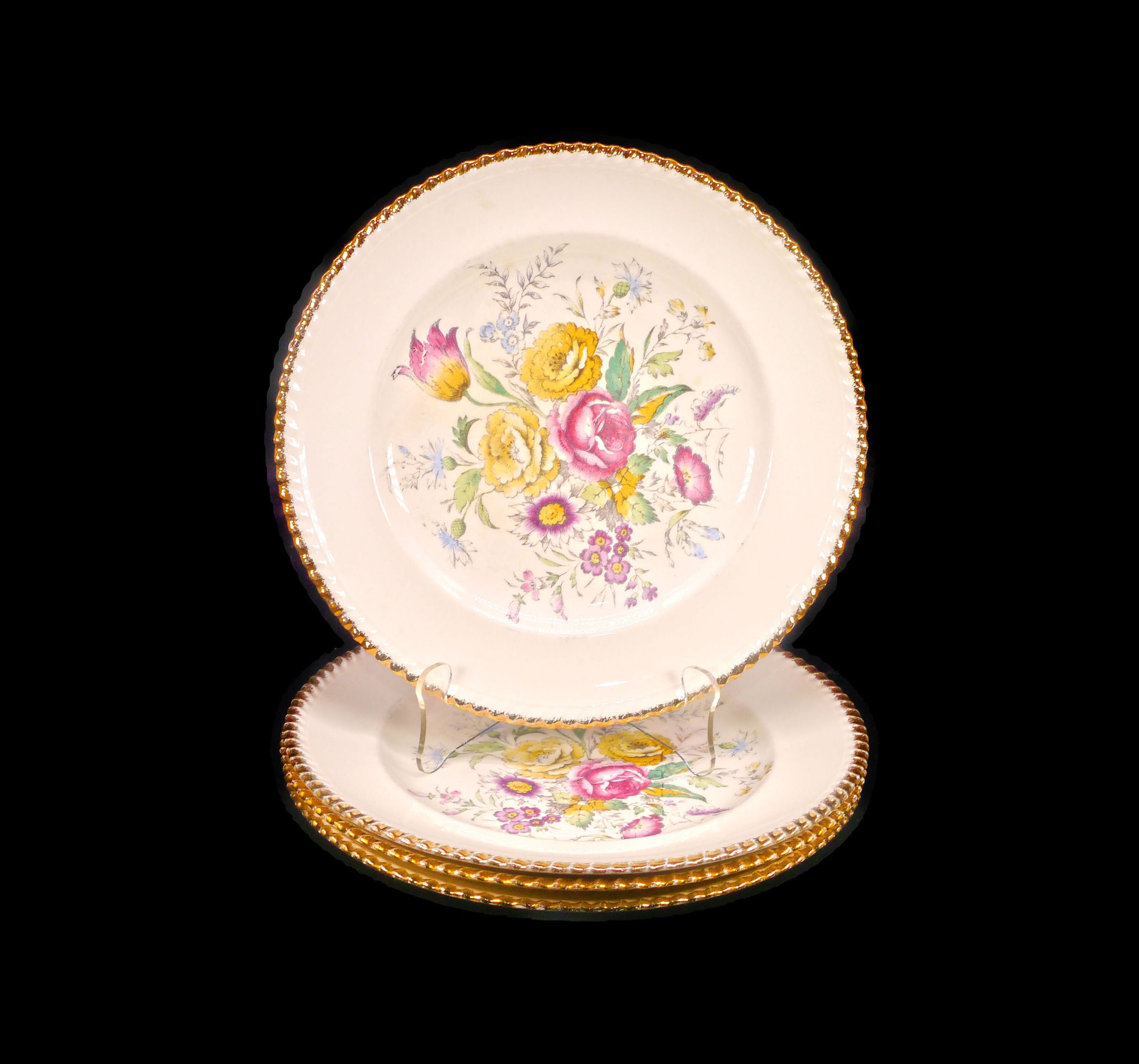 Four British Empire Ware Breath O' Spring dinner plates. Flaws (see below).