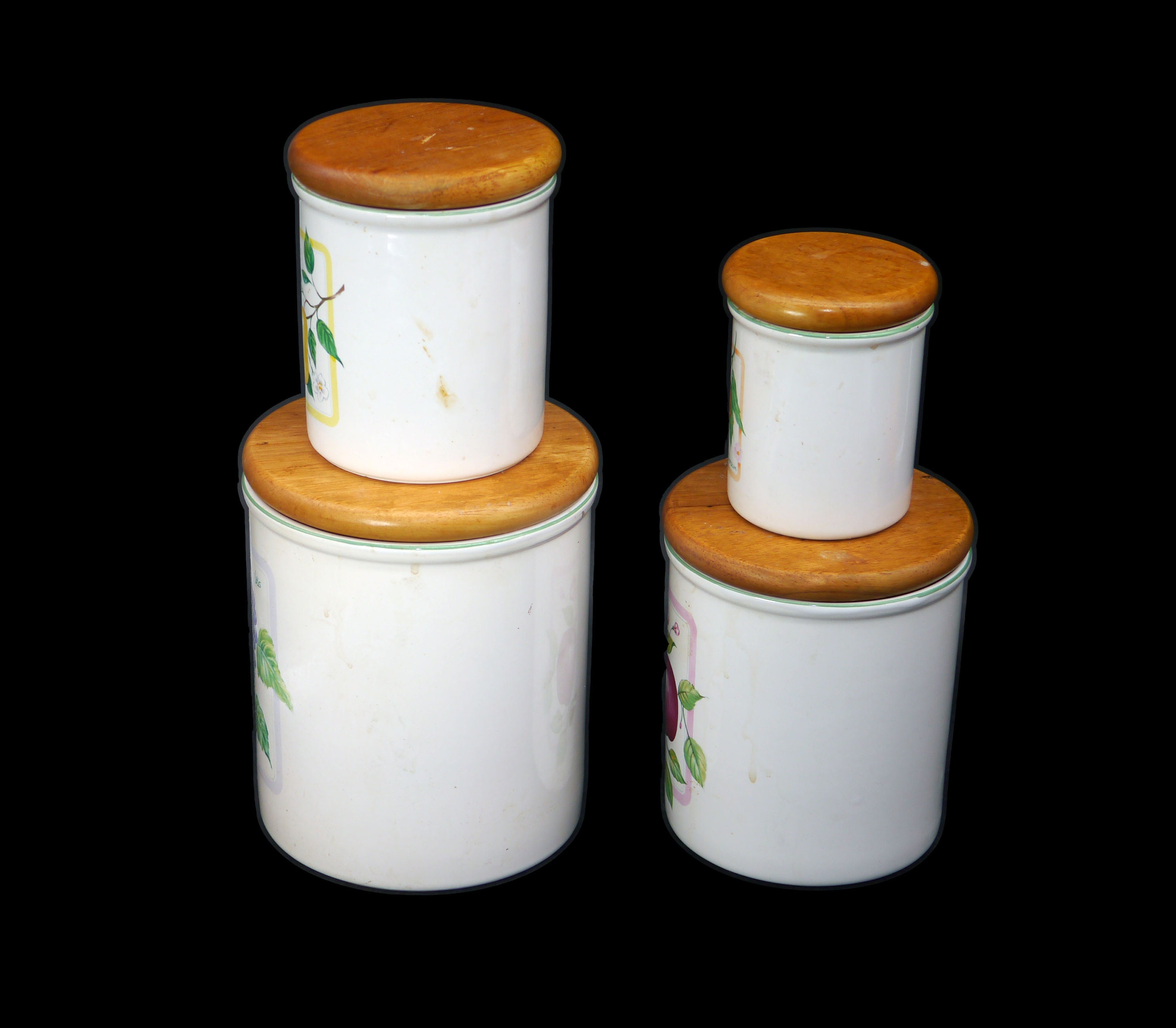 Four Himark Botanical fruit and herb themed canisters made in Taiwan.