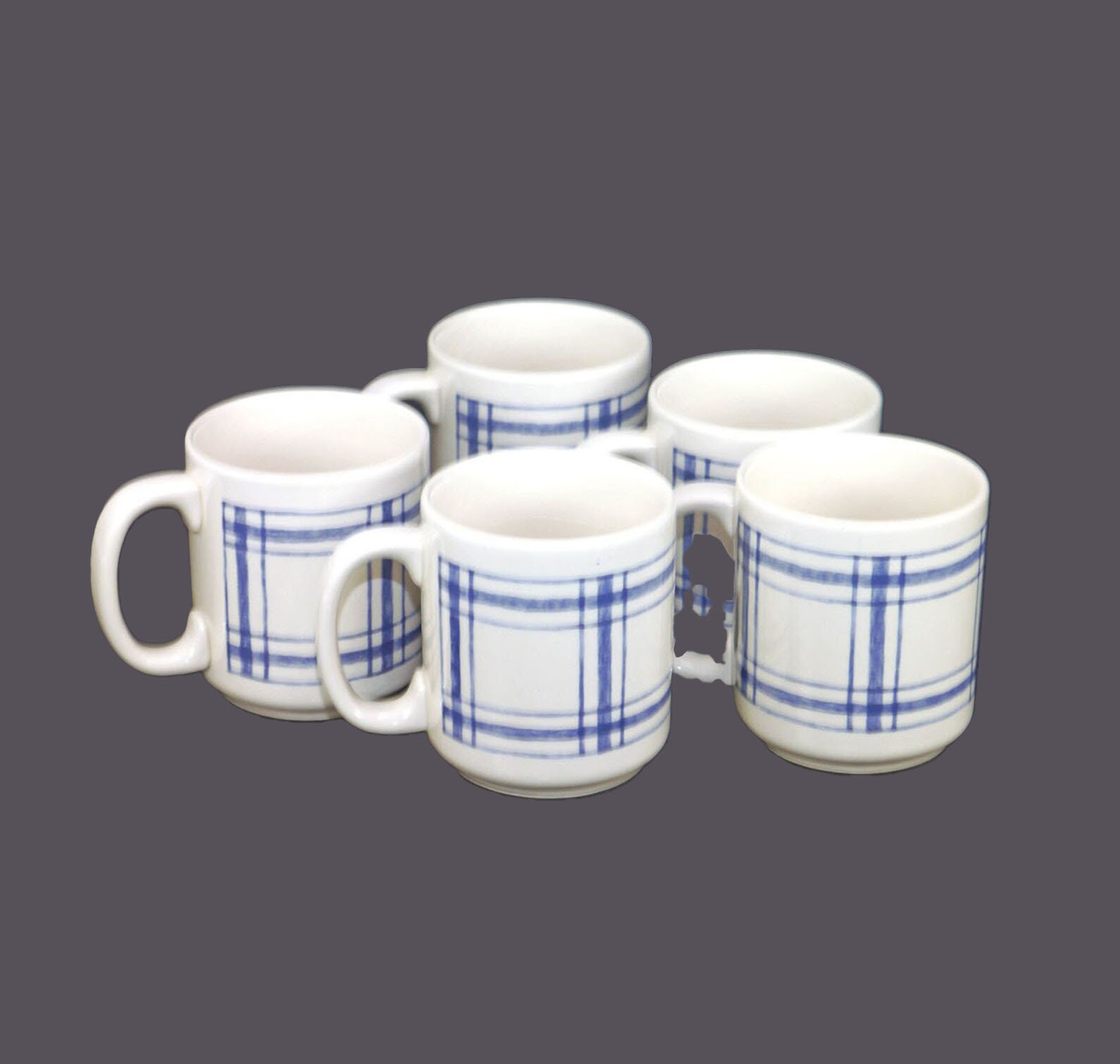 Five Eaton Home ceramic coffee or tea mugs. Blue-and-white checks.