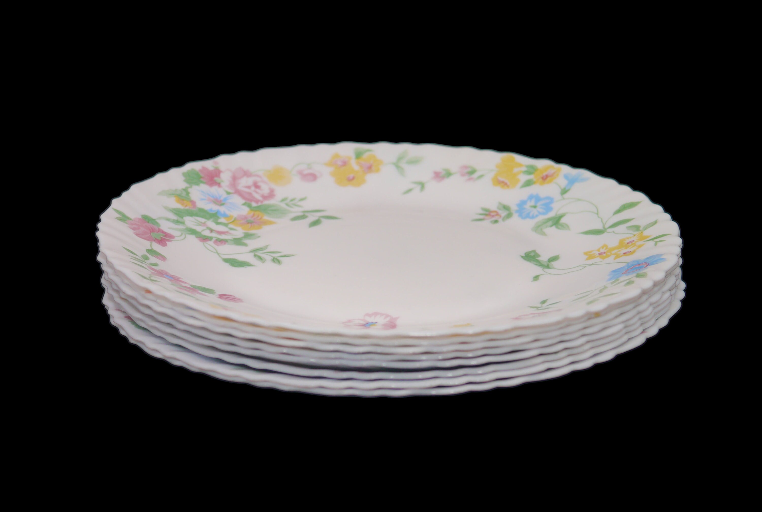 Eight Arcopal Feston Hortense large dinner plates made in France.