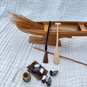 Cypress Dugout Canoe With Shotgun, Duck Decoys, Paddle, and Push Pole ...
