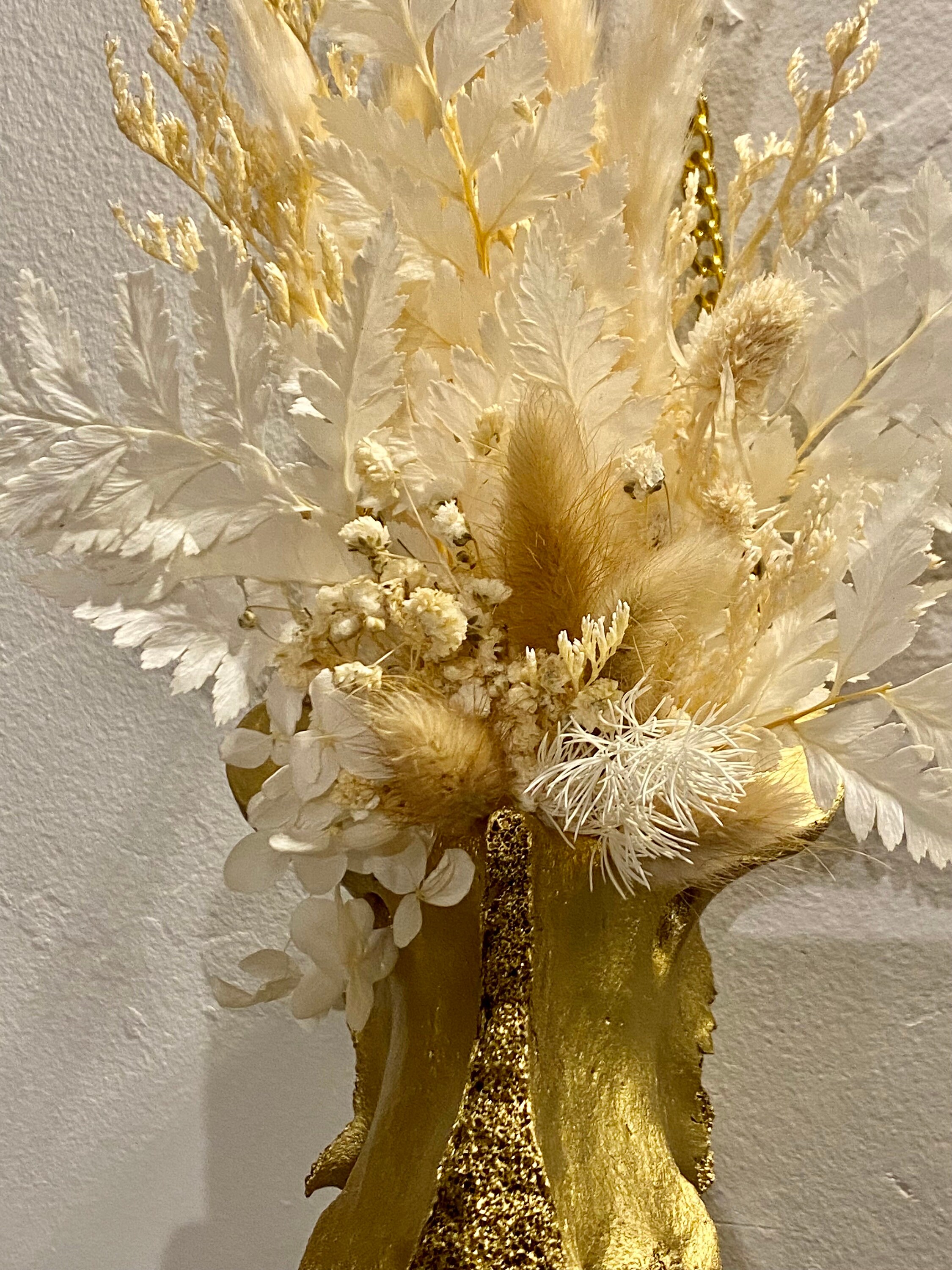 Luminous Hanging Cow Vertebrae Adorned With White Dried Flowers: Ferns ...