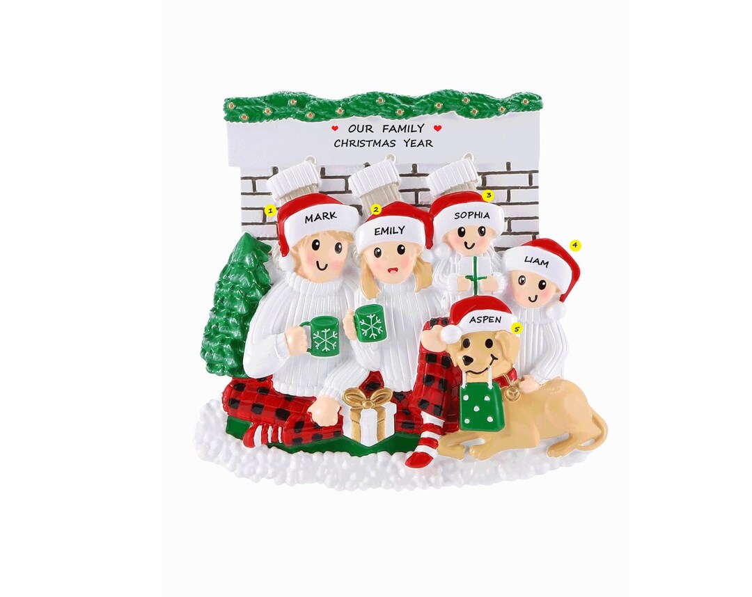 Family of 4 Celebrating Christmas by the Fire With Their Dog ...