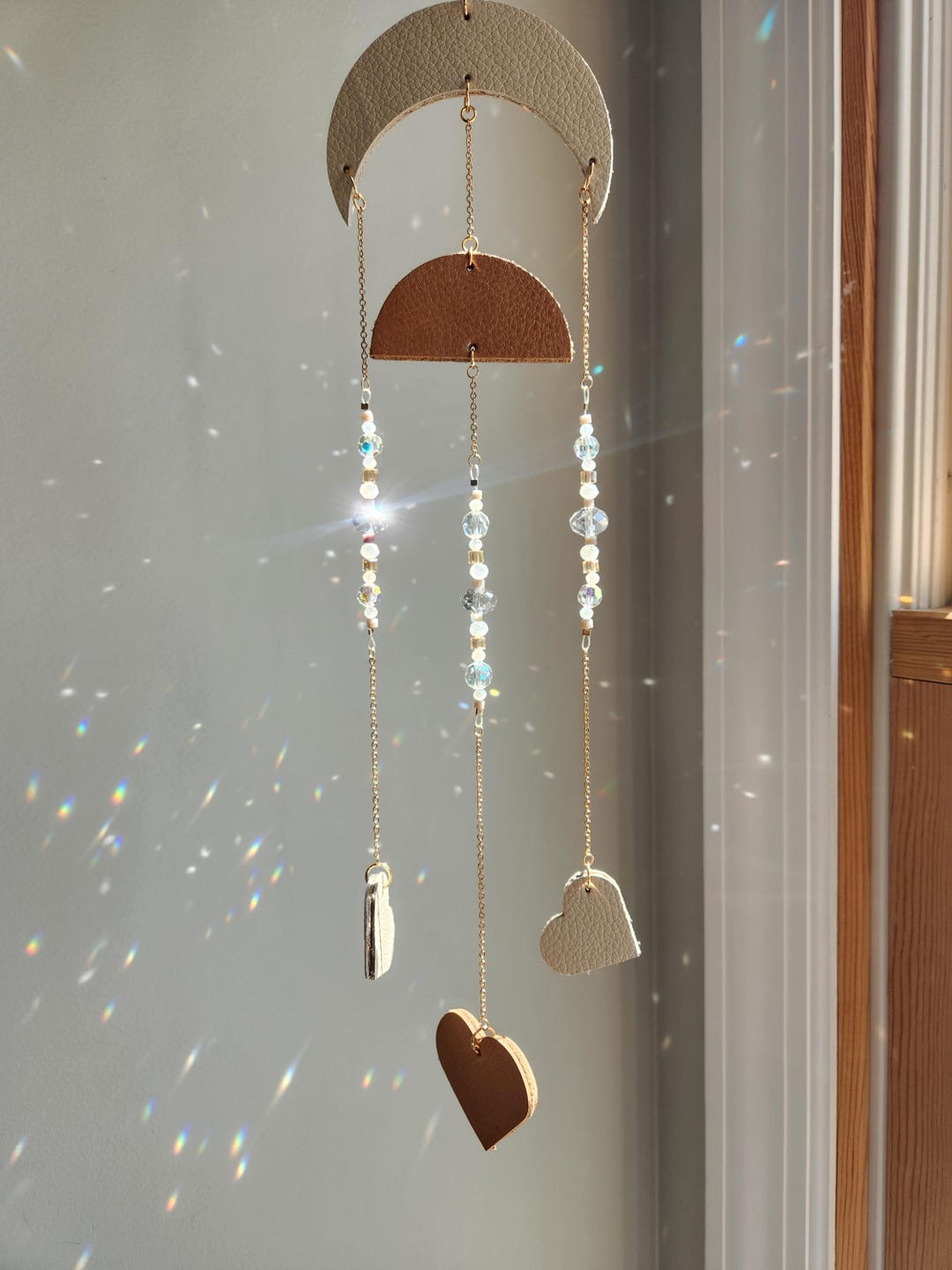 Fabulous Leather Moons, Hearts, and a Delicate Gold Chain Adorned With ...