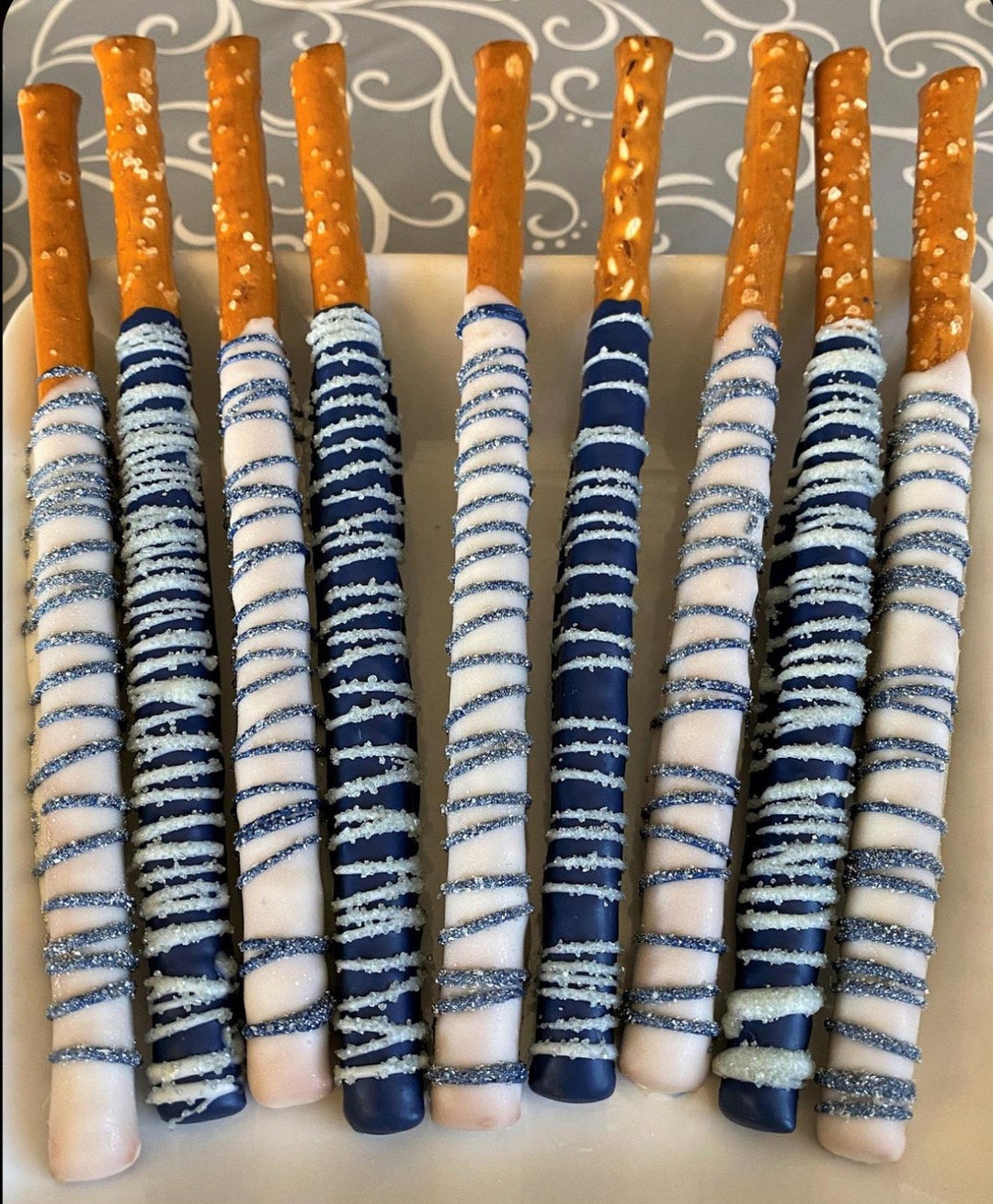 1/2 White and 1/2 Blue Dipped Pretzel Rods With Blue Drizzle and ...
