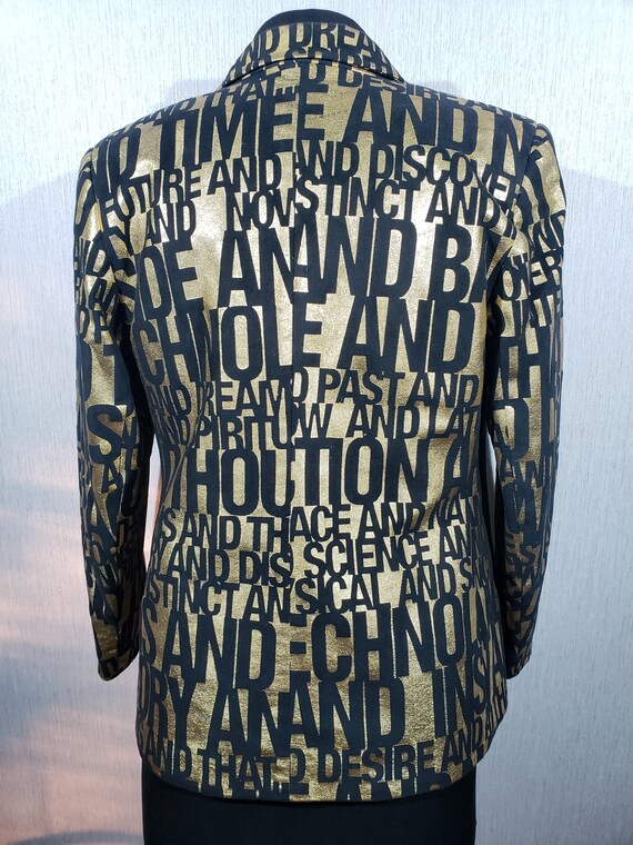 Gorgeous gold jacket with black lettering. Gold and b… - Gem