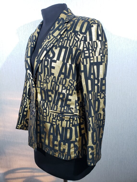 Gorgeous gold jacket with black lettering. Gold and b… - Gem