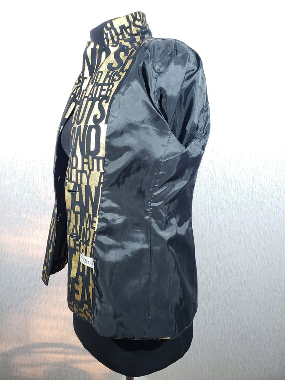 Gorgeous gold jacket with black lettering. Gold and b… - Gem