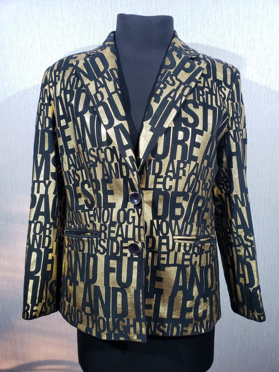 Gorgeous gold jacket with black lettering. Gold and b… - Gem