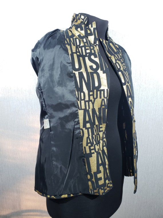 Gorgeous gold jacket with black lettering. Gold and b… - Gem