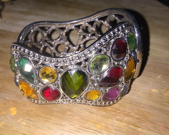 Bracelets- one bronze toned cuff and one jeweled cuff… - Gem