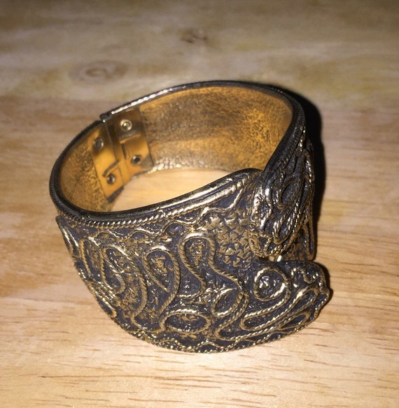 Bracelets- one bronze toned cuff and one jeweled cuff… - Gem