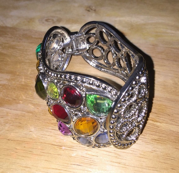 Bracelets- one bronze toned cuff and one jeweled cuff… - Gem