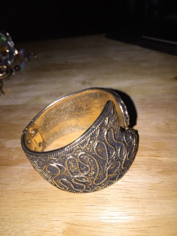 Bracelets- one bronze toned cuff and one jeweled cuff… - Gem