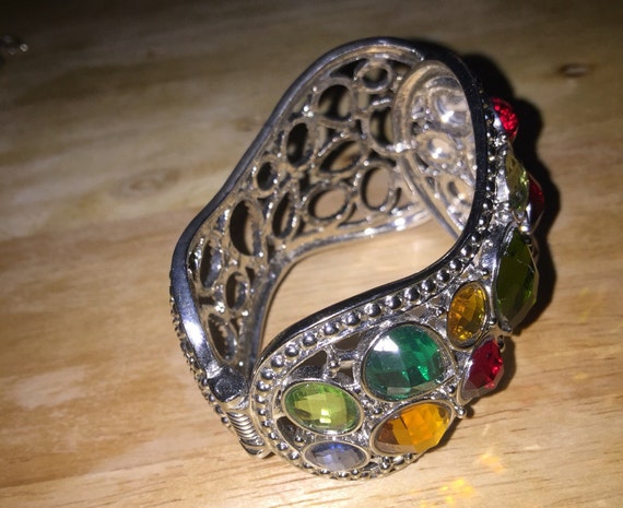 Bracelets- one bronze toned cuff and one jeweled cuff… - Gem