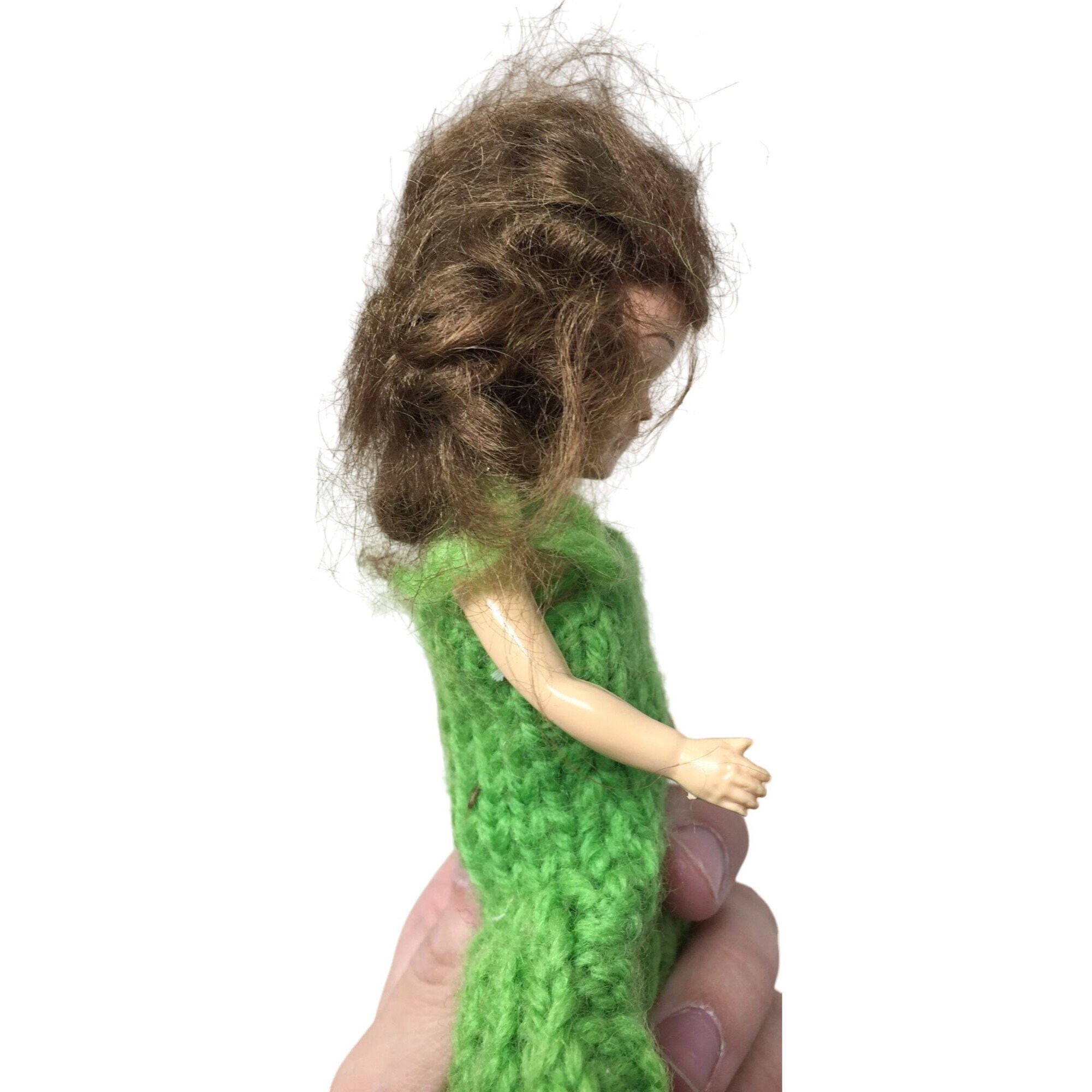 Vintage Collectible Doll With Brown Hair Wearing Green Crocheted Dress