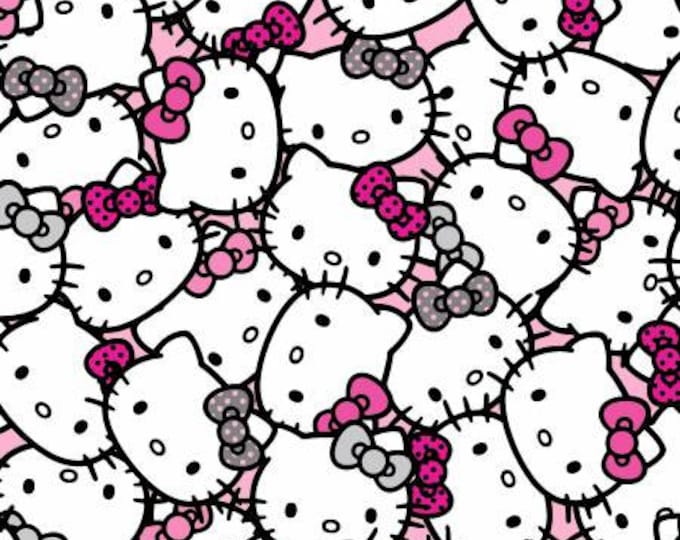 KNIT Fabric: Sanrio ® Hello Kitty- Packed Heads Cotton Lycra Knit. Sold ...