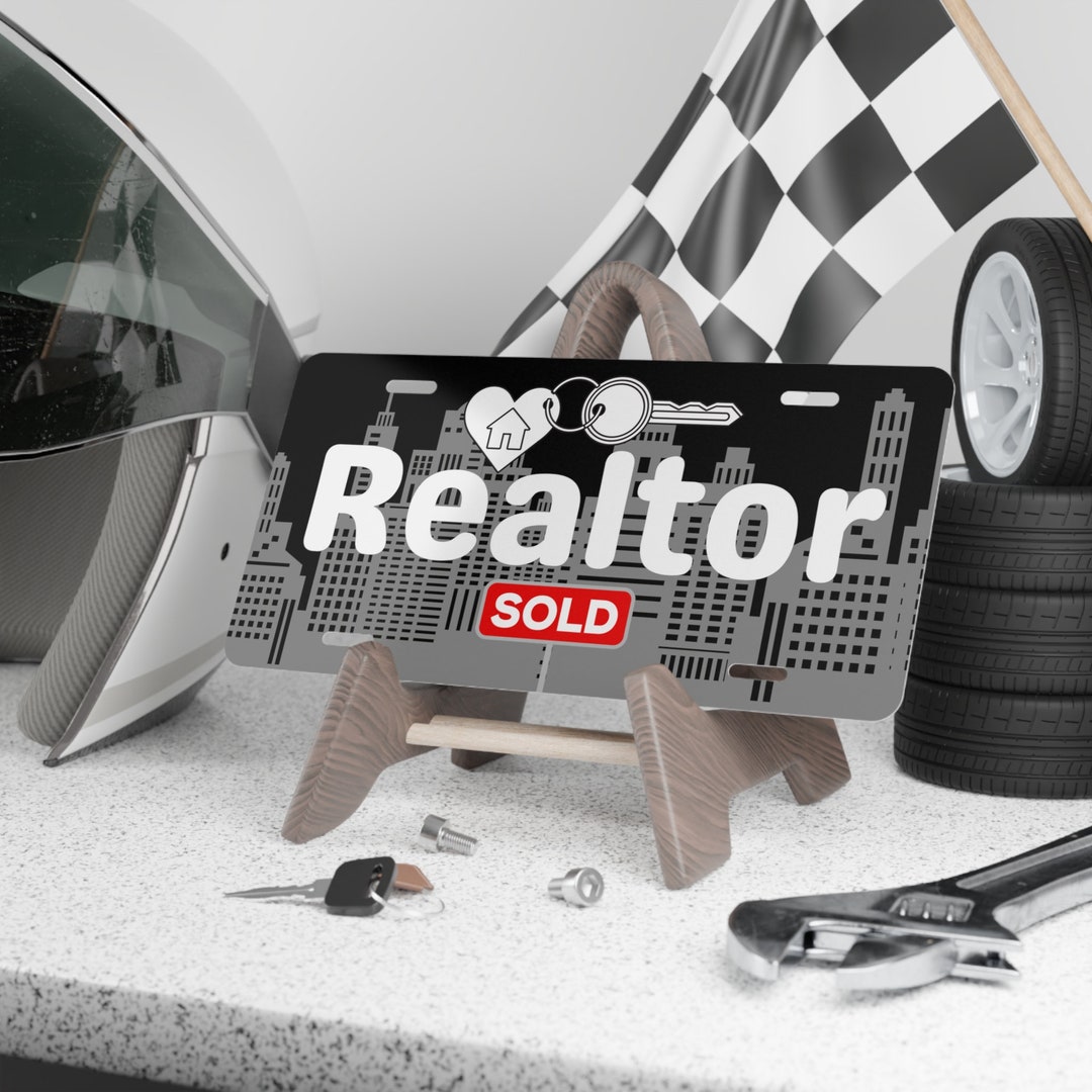 Realtor Vanity License Plate With Cityscape Background and a Sold Sign ...