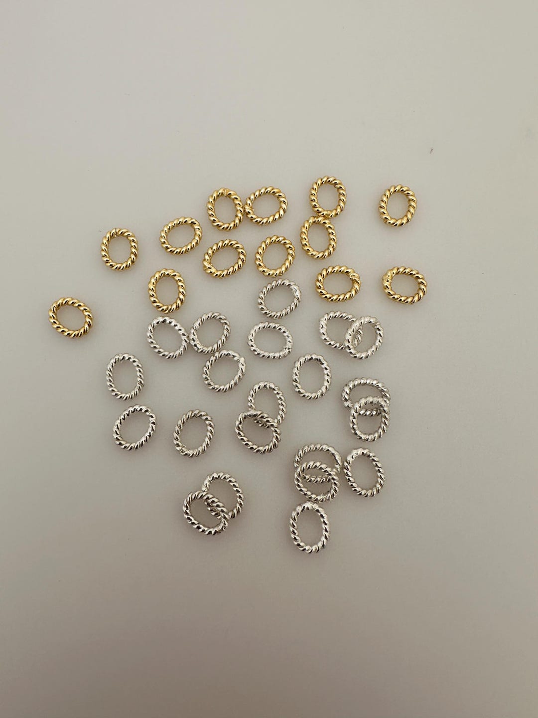 Oval Shape Twisted Rings About 125 Pcs. Gold Finish and Silver Plated ...