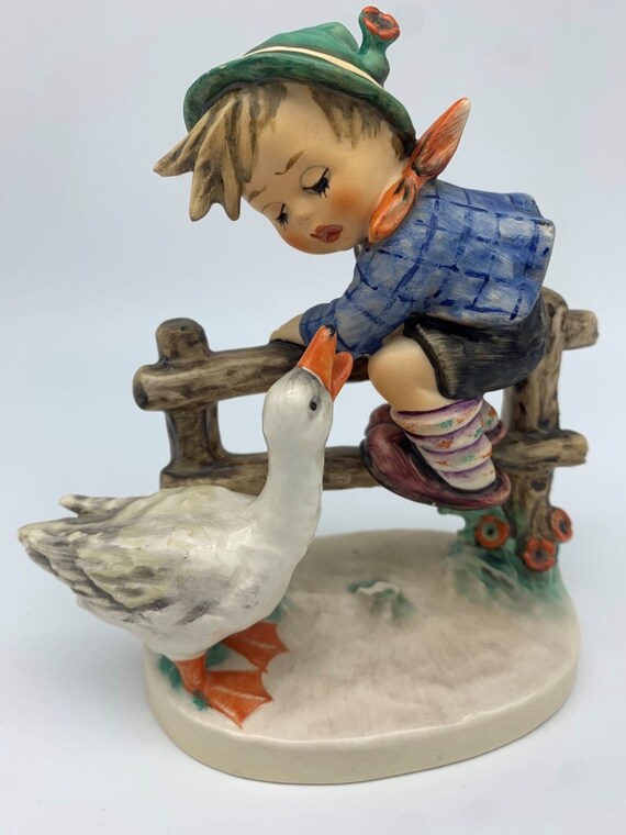Hummel boy on fence with goose store