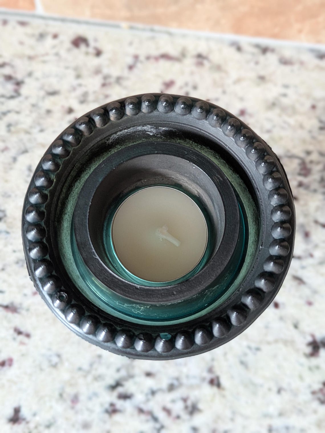 Repurposed Blue Insulator With Rusty Bedspring Holding an Ivory ...