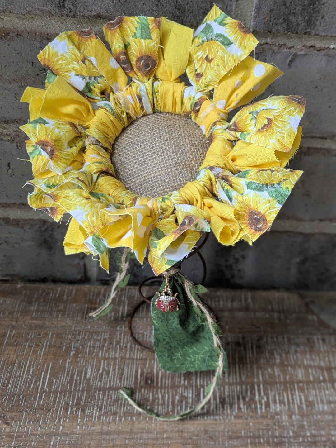 Rusty Bedspring With a Farmhouse Sunflower Rag Tie Flower and Ladybug ...