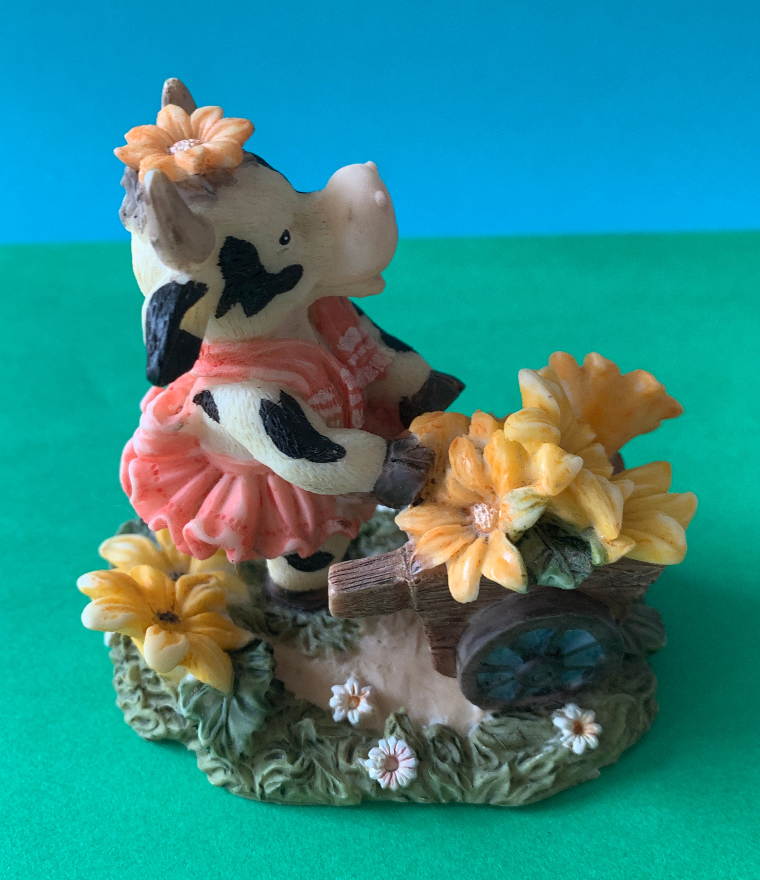 Vintage Cute Cow in a Pink Dress Pushing a Wheelbarrow Full of Yellow ...