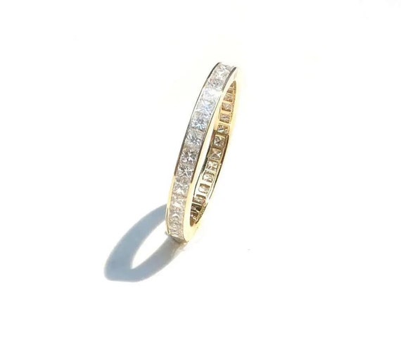 Princess cut eternity ring yellow gold store