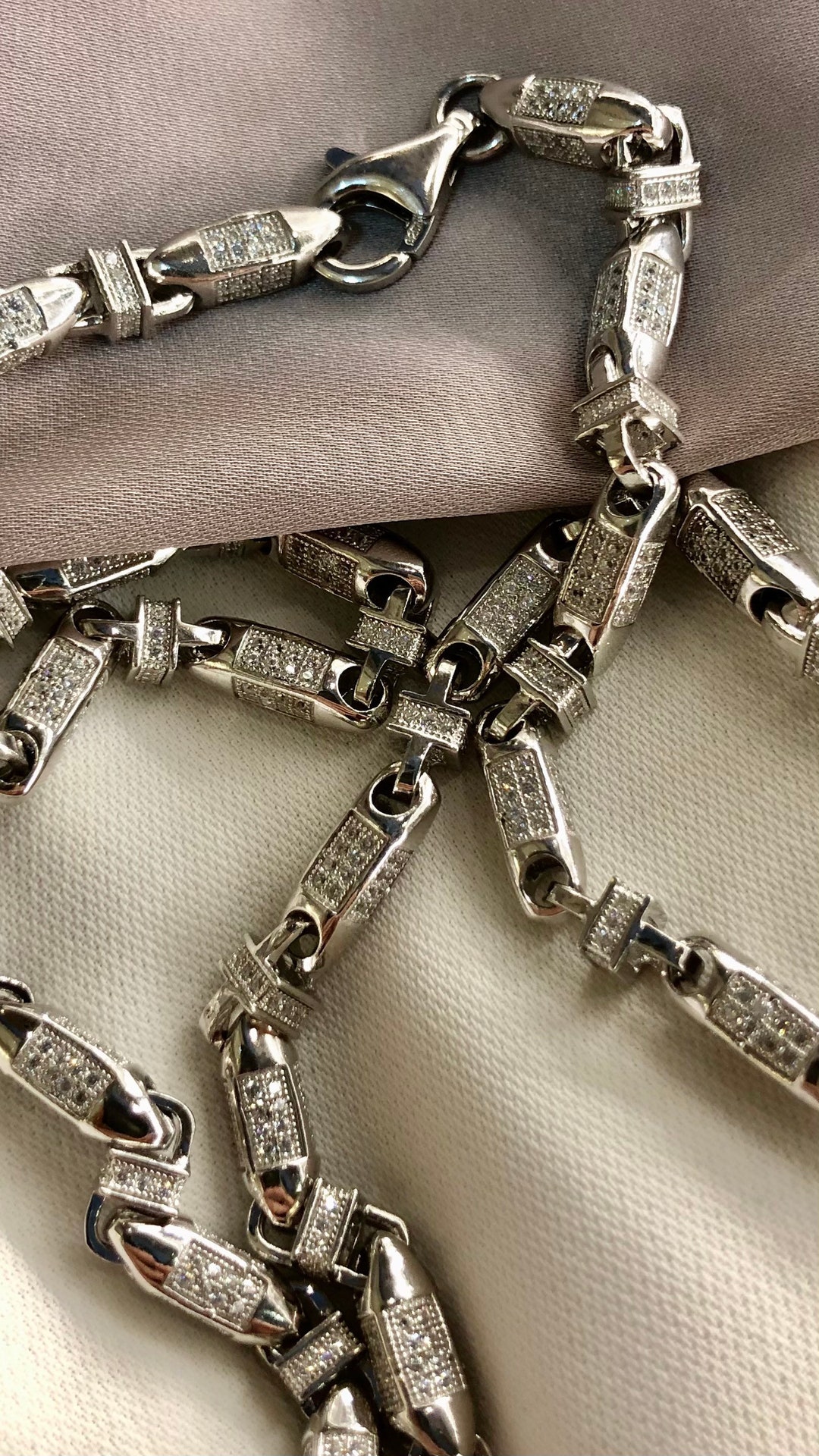 Silver chain with cubic zirconia store