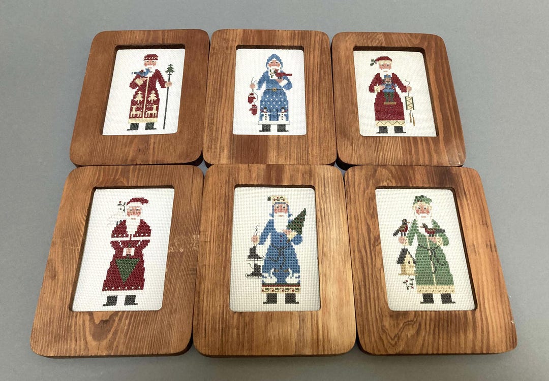 Collection of Framed Prairie Schooler Santa Christmas Completed Cross ...
