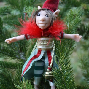Cotton and polymer elf doll with red feather and bells | Etsy
