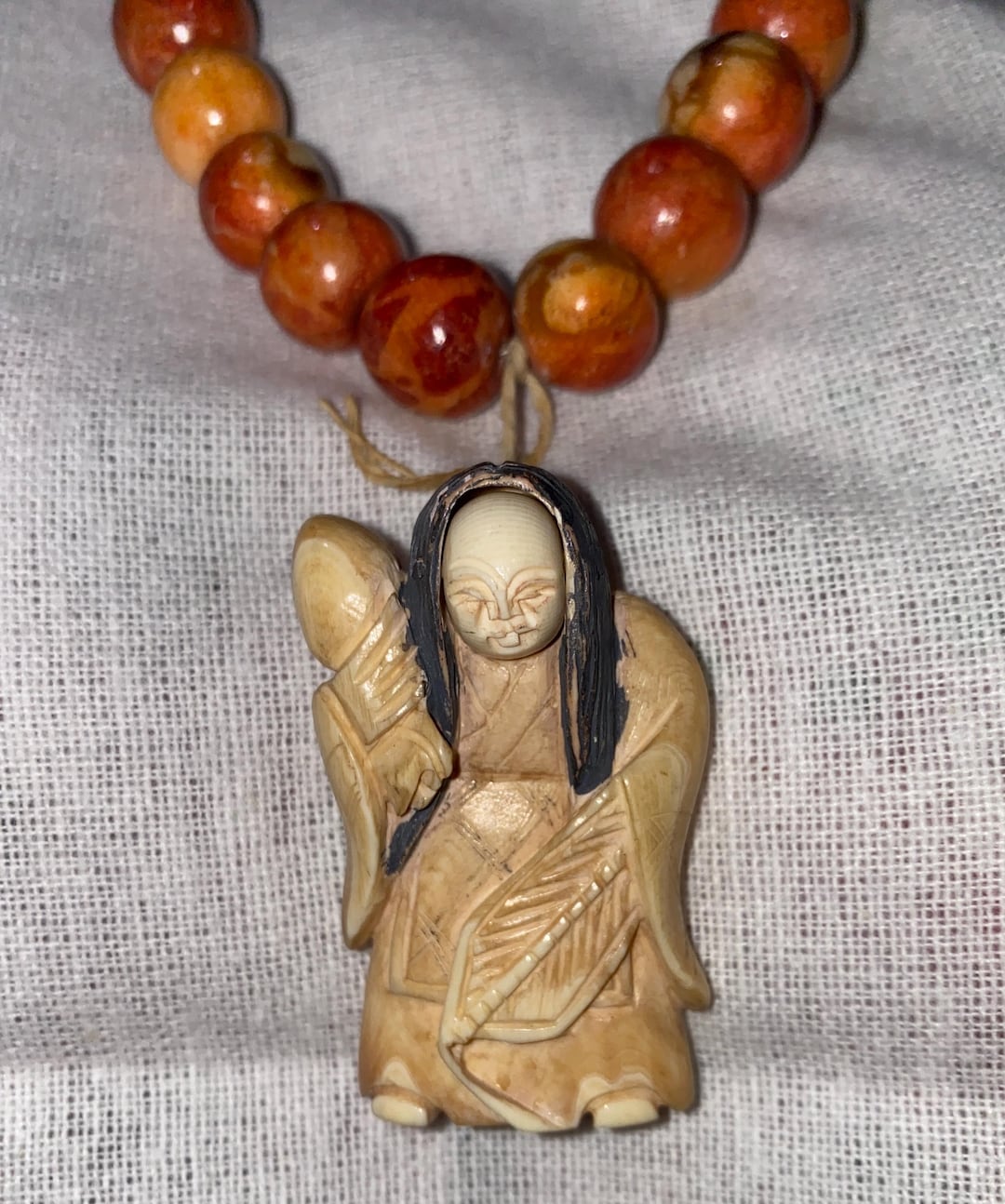 Vintage Carved Rotating Face Netsuke Pendant on Apple Coral Bead ...