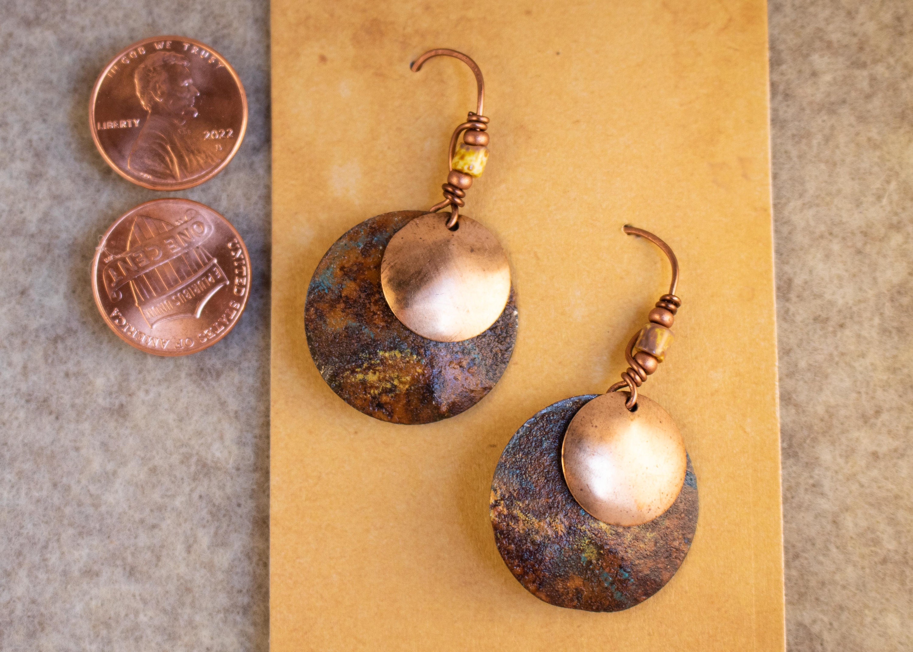 Salvaged Rusty Metal Circles Layered With Raw Copper Circles Hang From ...