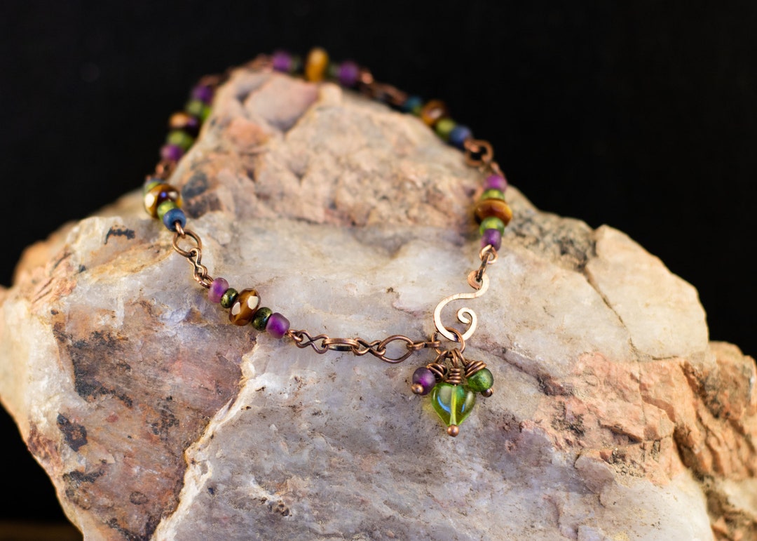 Tiny Green Glass Heart and Purple and Green Matte Glass Beads Form a ...