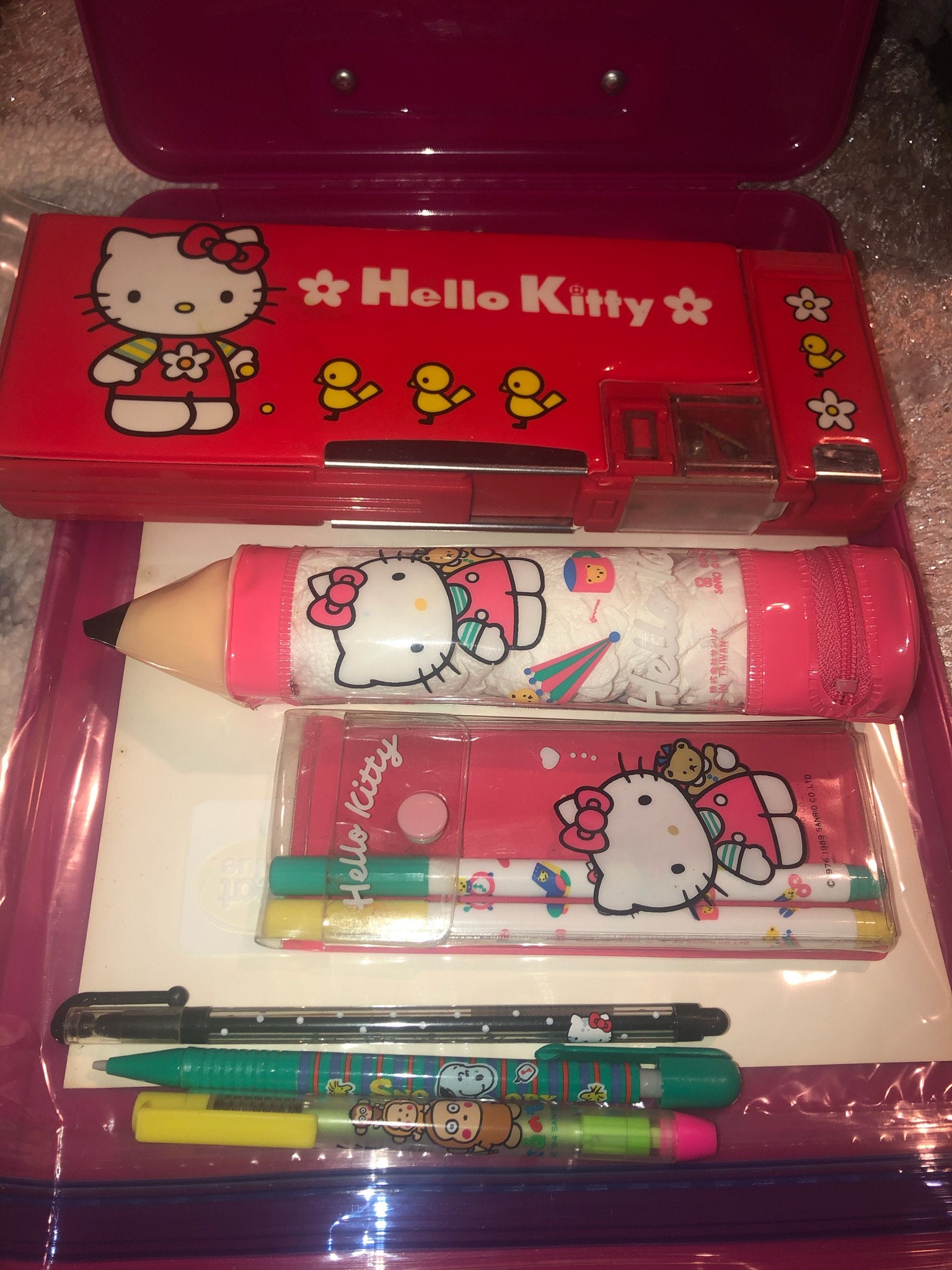 Hello Kitty Holding Pencil