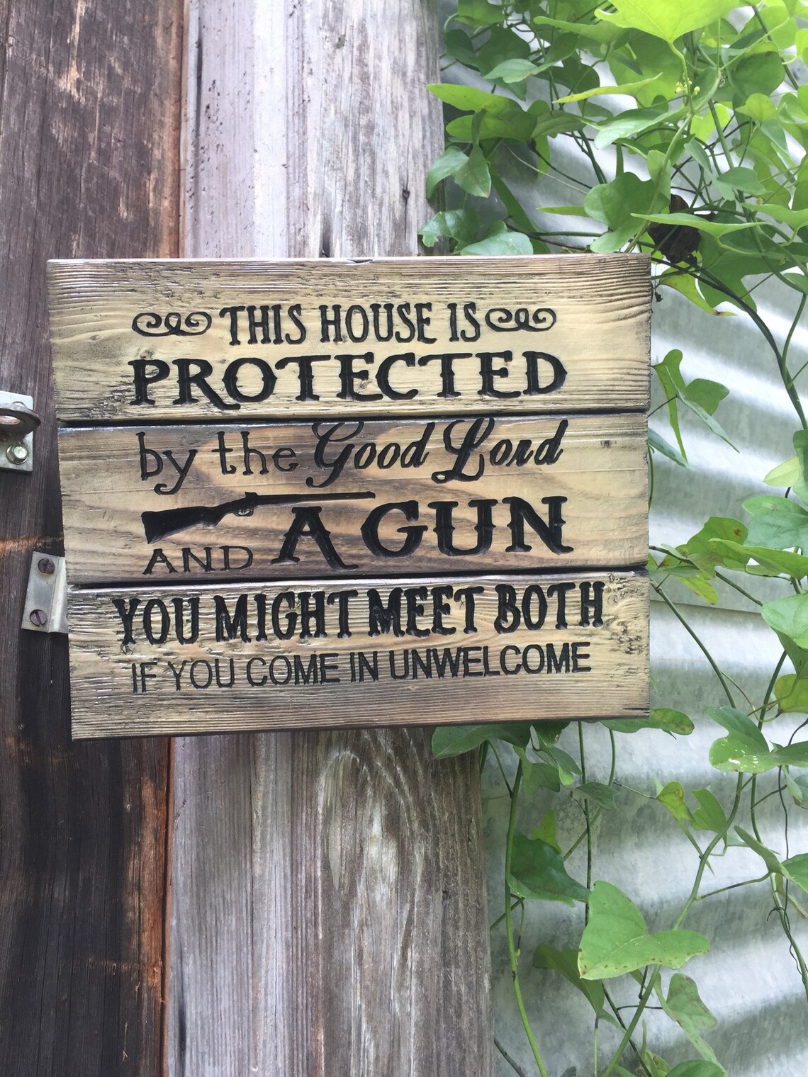 Carved This House is Protected by the Good Lord and A Gun Sign ...