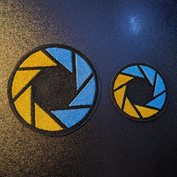 Orange Aperture Science Logo