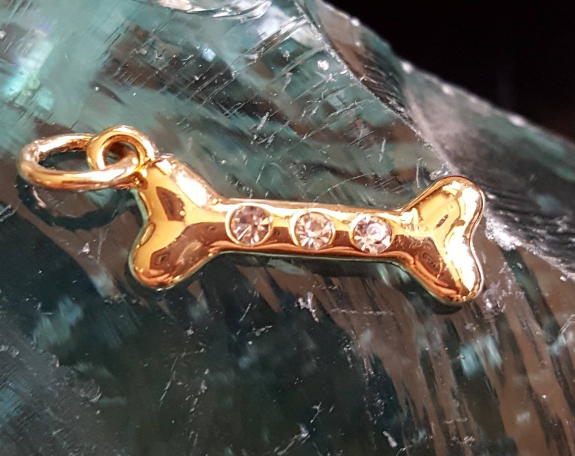 Gold dog bone charm with crystals tiny dogbone charm gold | Etsy