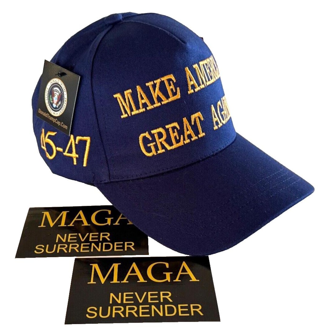 Trump...official..gold / Navy Blue MAGA ..45-47... Hat..+ 2 Decals ...