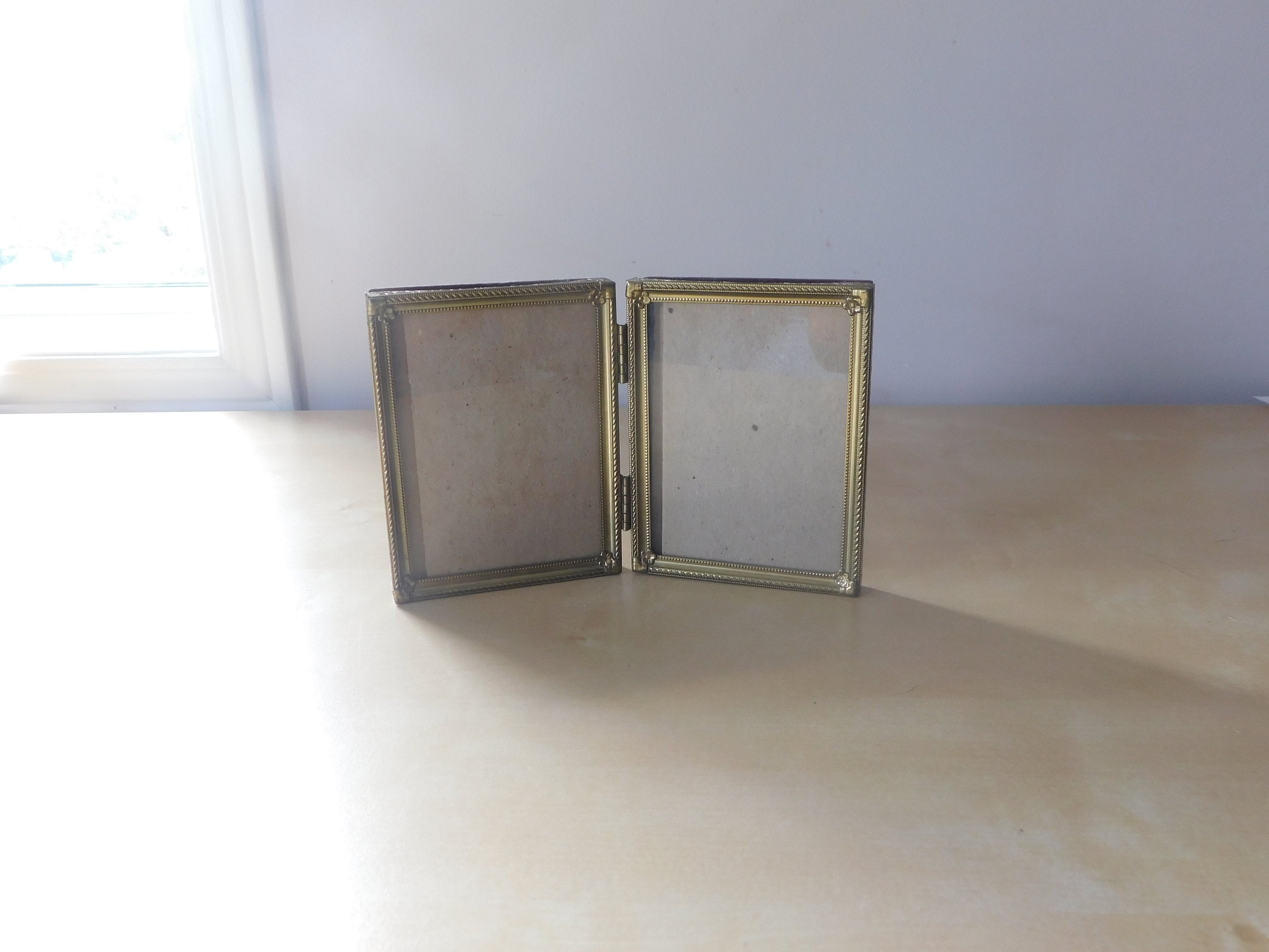 Bi Fold Picture Frame Stands On Floor