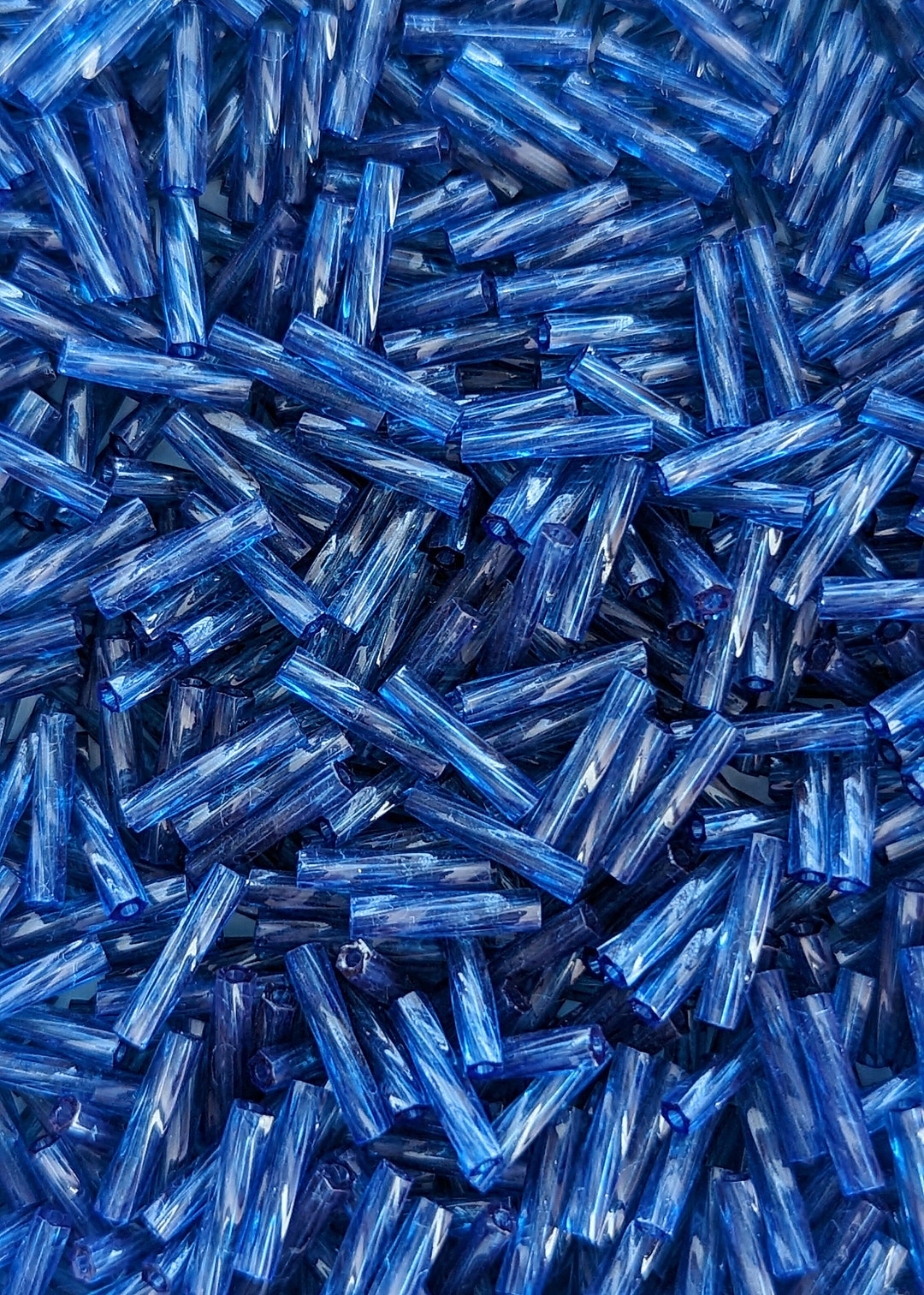 2.7mm X 12mm Twisted Bugle Beads - Transparent Montana Blue - 10 Grams ...