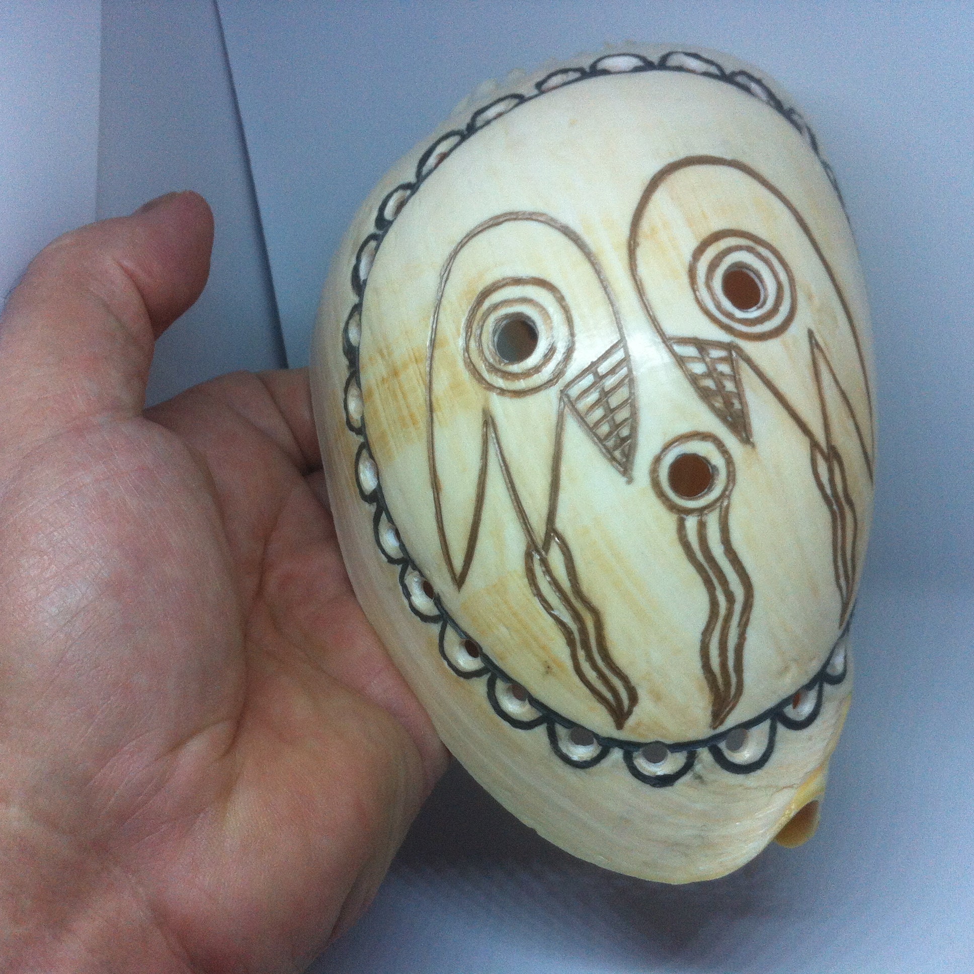 Engraved Melo Shell: Replica of a Shaman's Head With the Weeping Eyes ...