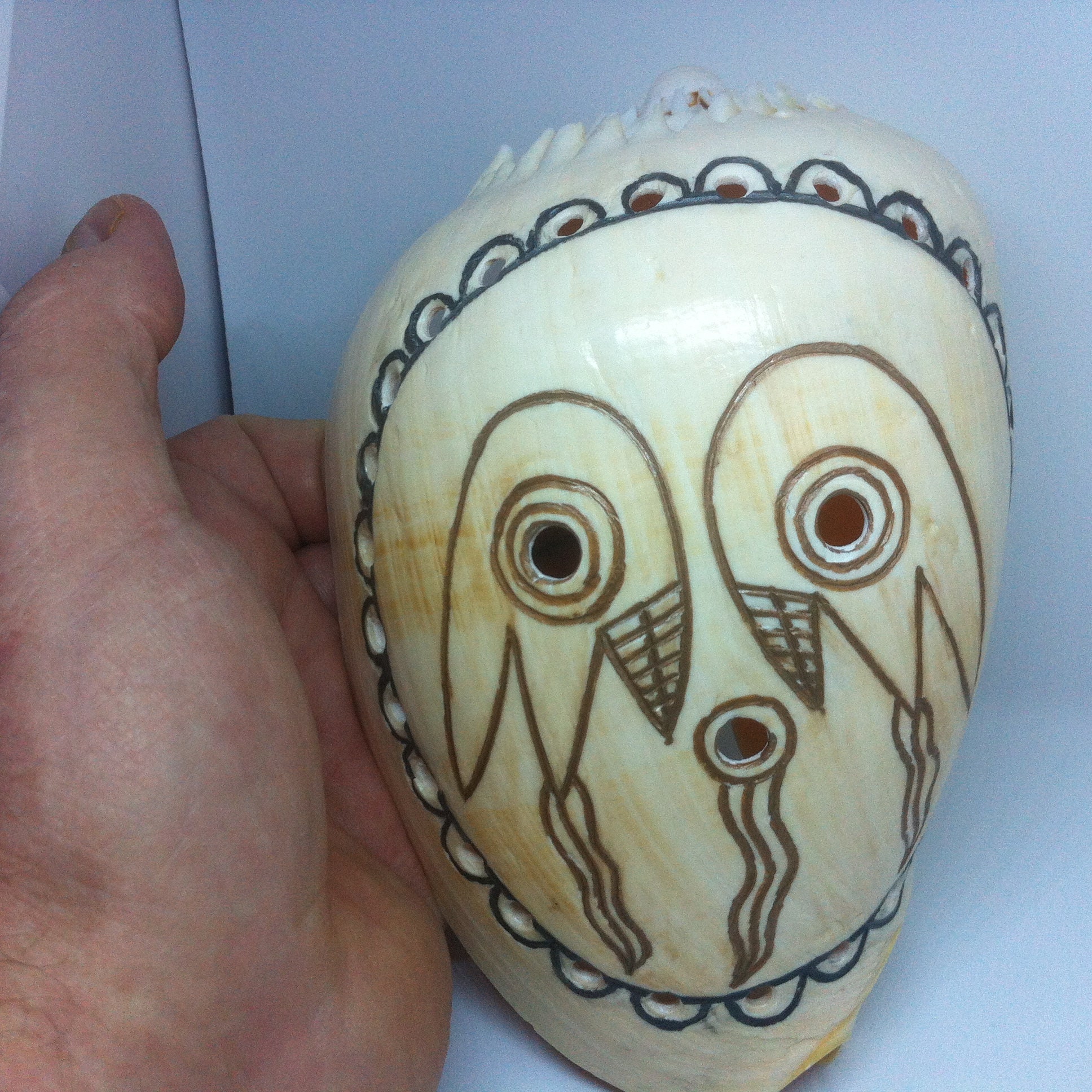 Engraved Melo Shell: Replica of a Shaman's Head With the Weeping Eyes ...