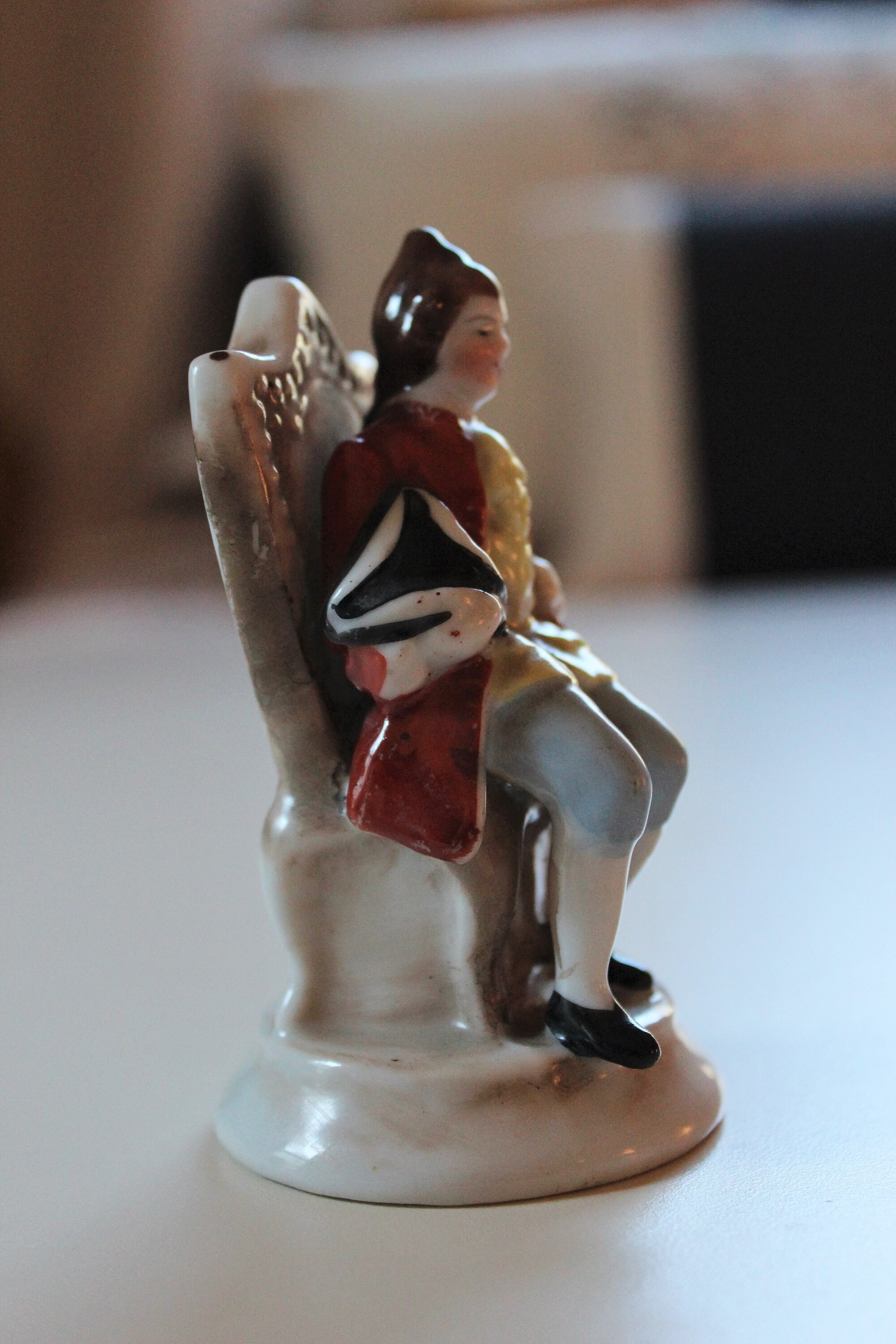 Colonial Porcelain Figurine of Seated Man - Etsy