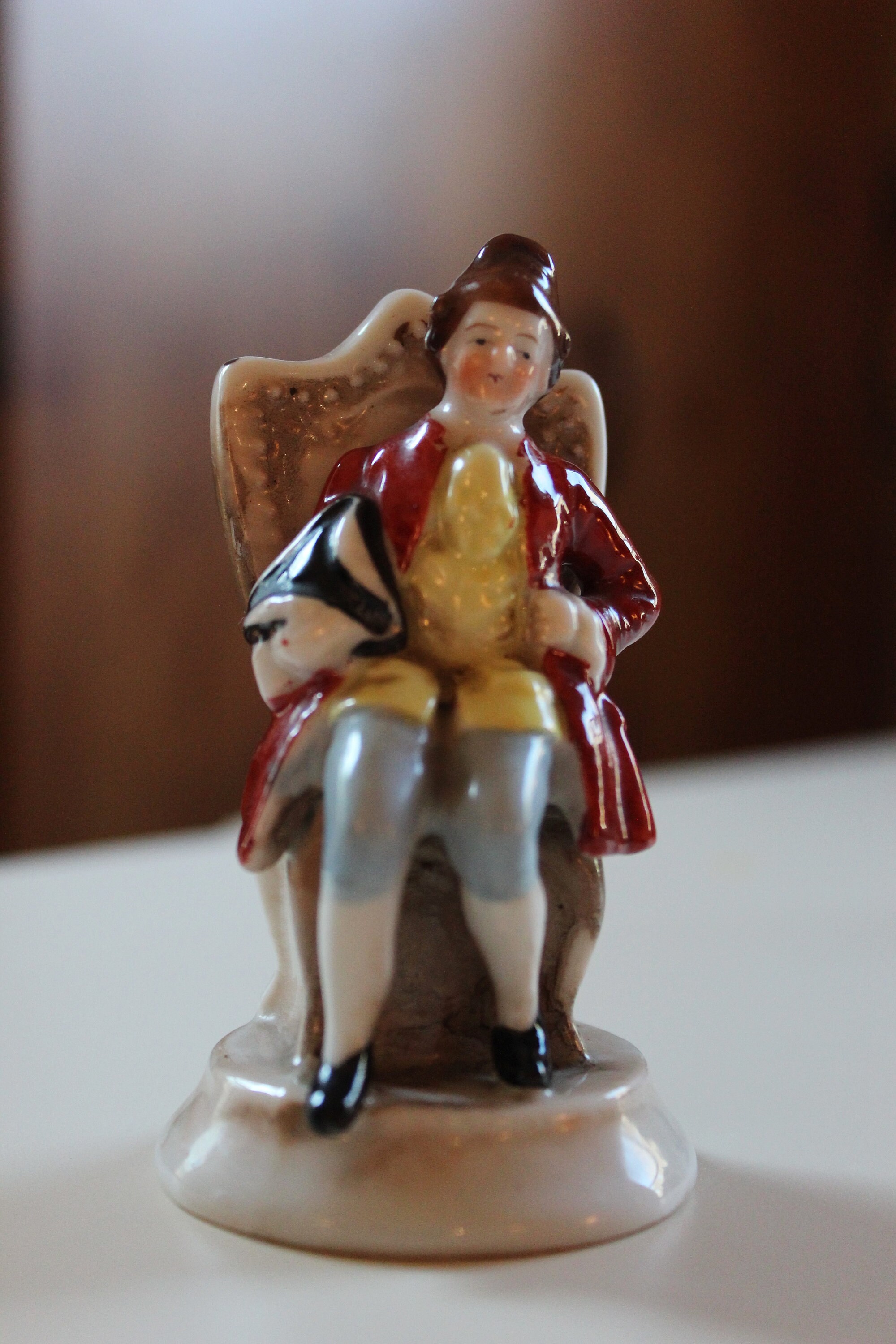 Colonial Porcelain Figurine of Seated Man - Etsy
