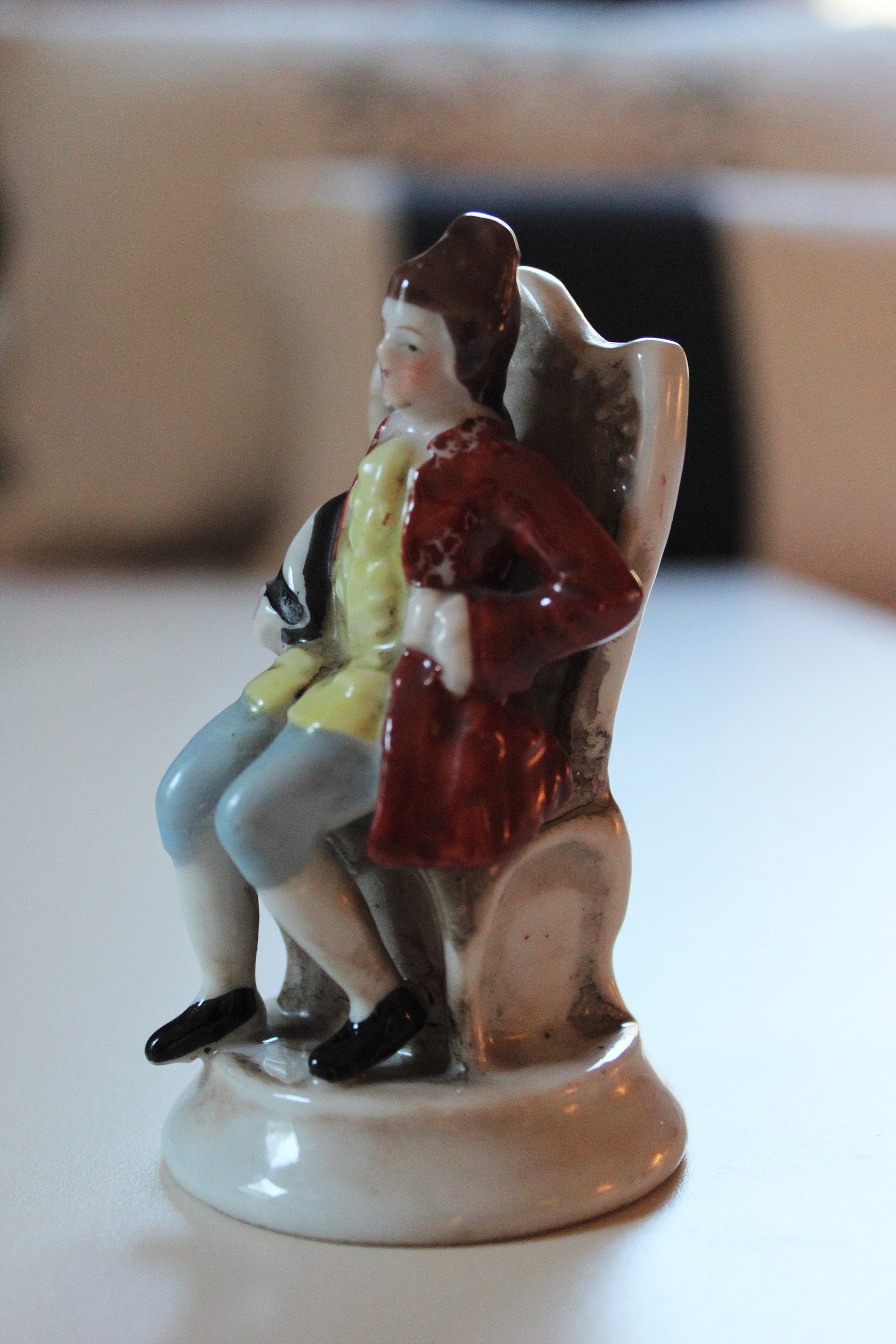 Colonial Porcelain Figurine of Seated Man - Etsy