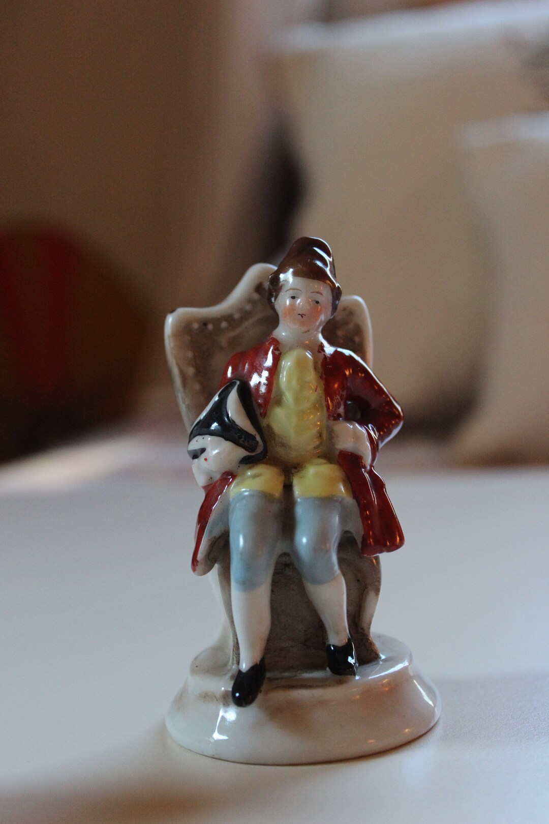 Colonial Porcelain Figurine of Seated Man - Etsy
