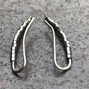 titanium crawler earrings