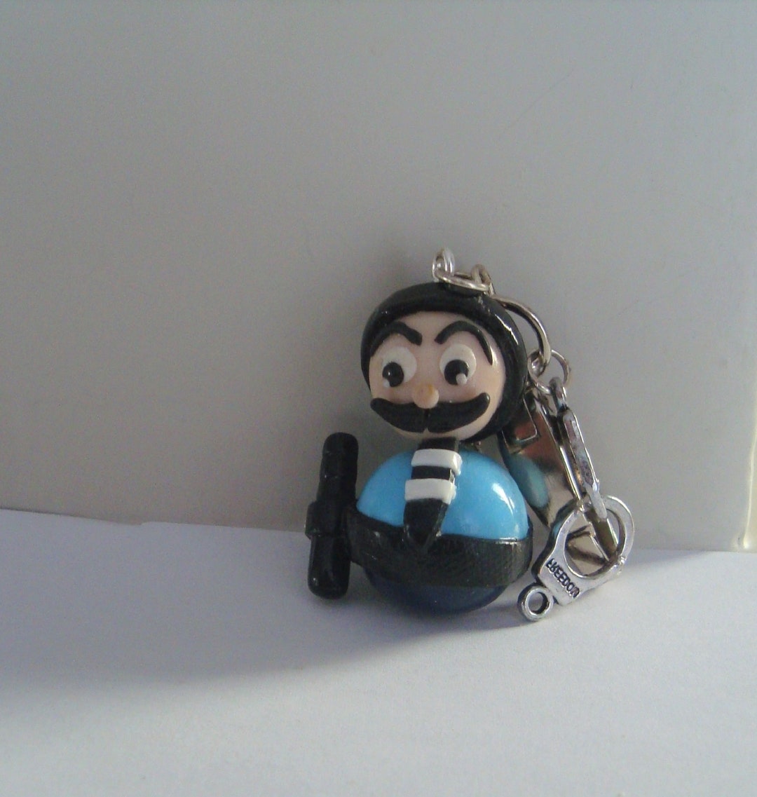 Fimo Key Ring With a Police Officer, a Pair of Handcuffs, a Pistol, a ...